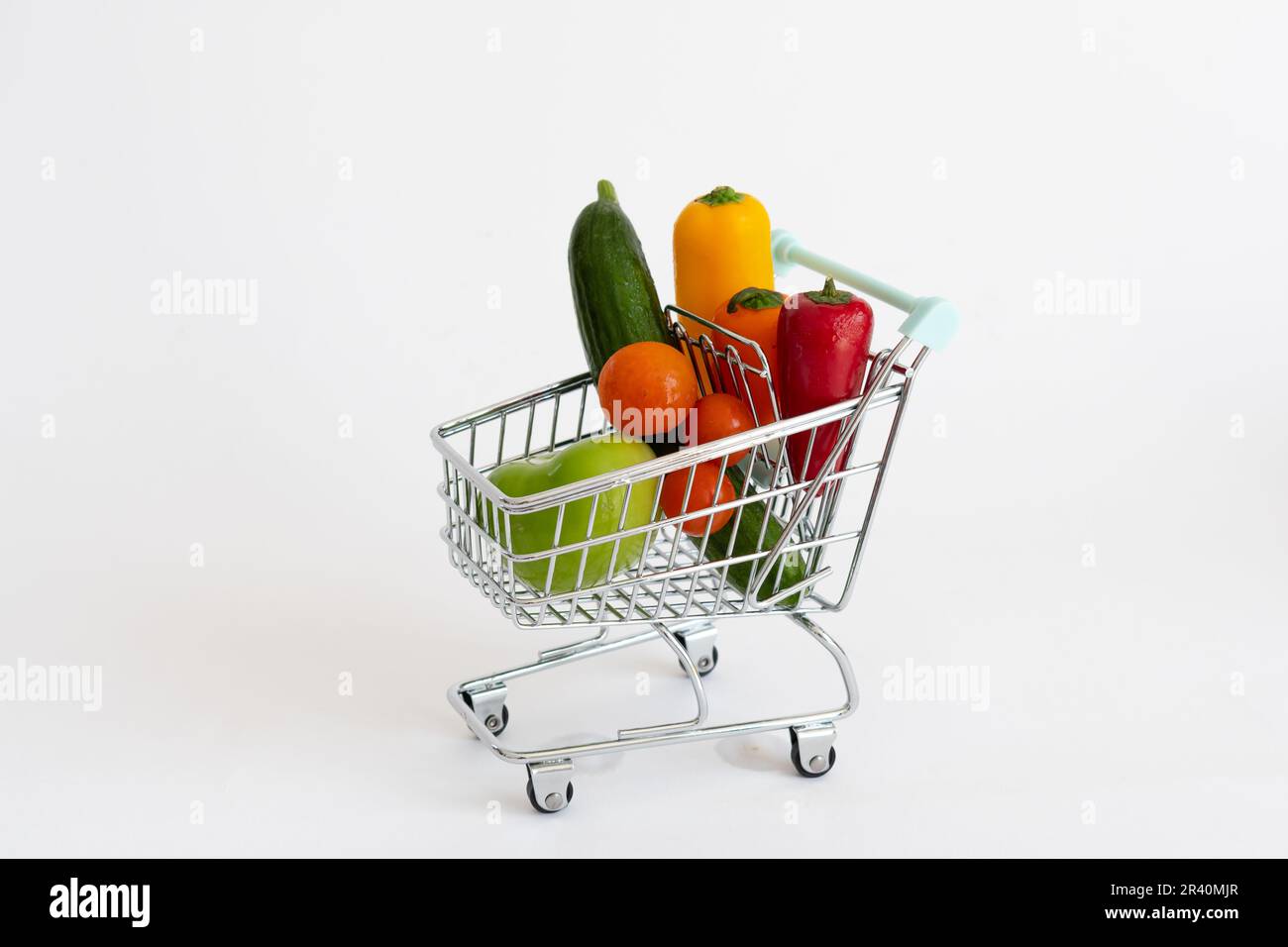 Shopping cart full of vegetables. Vegan food, healthy diet. White ...