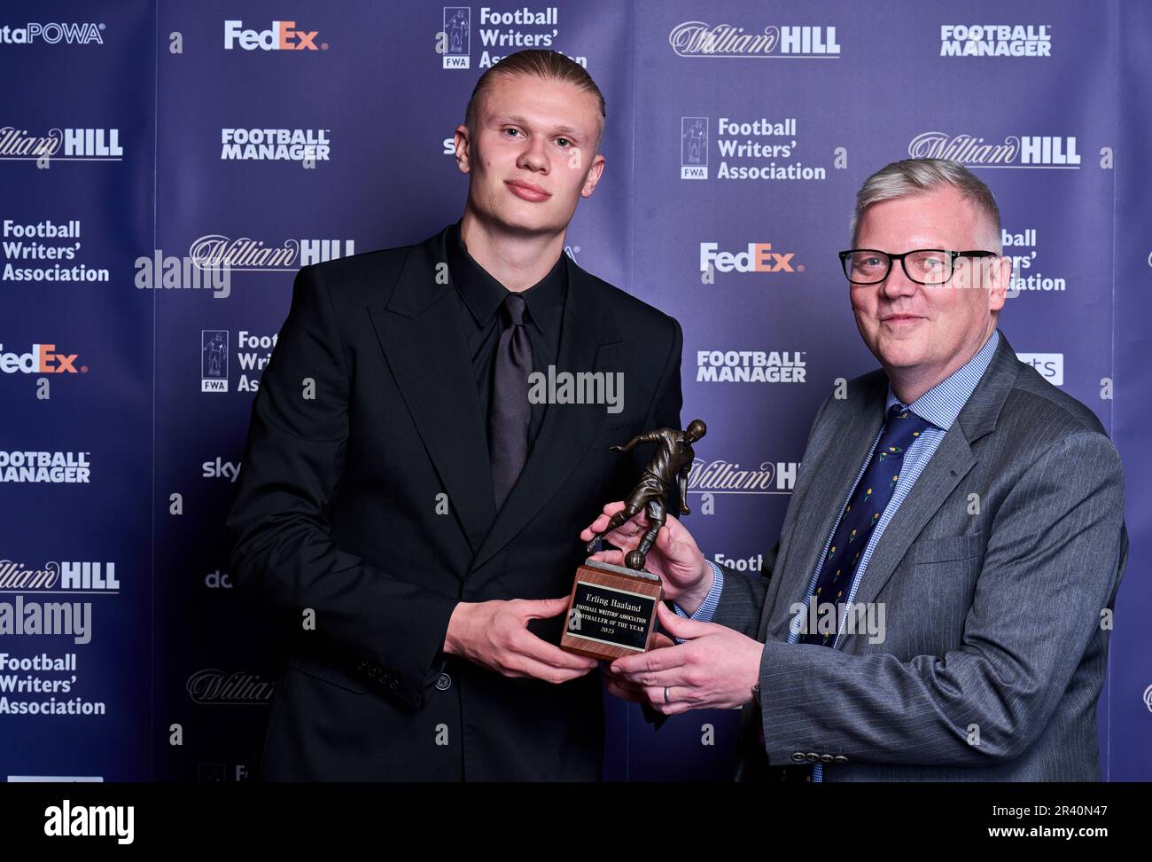 Erling Haaland ((left) with his FWA footballer of the year trophy ...