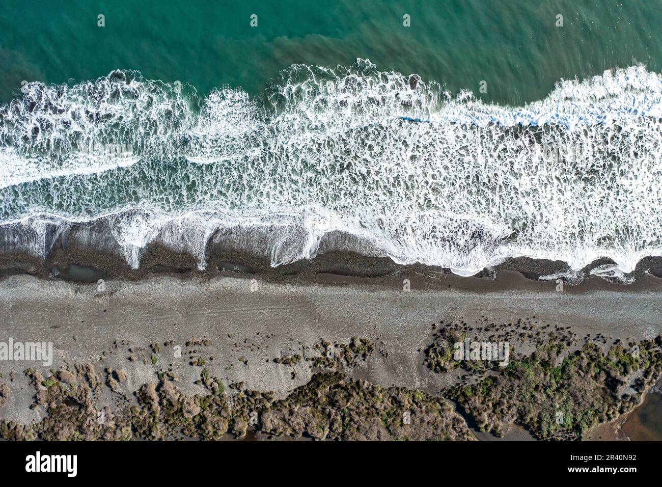 Aerial view of chilean ocean with black snd beach. Top view from drone ...