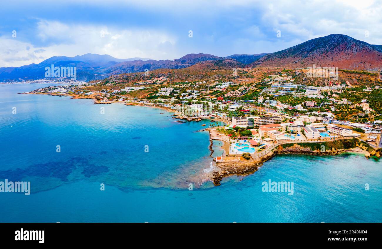 Hersonissos town aerial panoramic view. Hersonissos or Chersonissos is ...