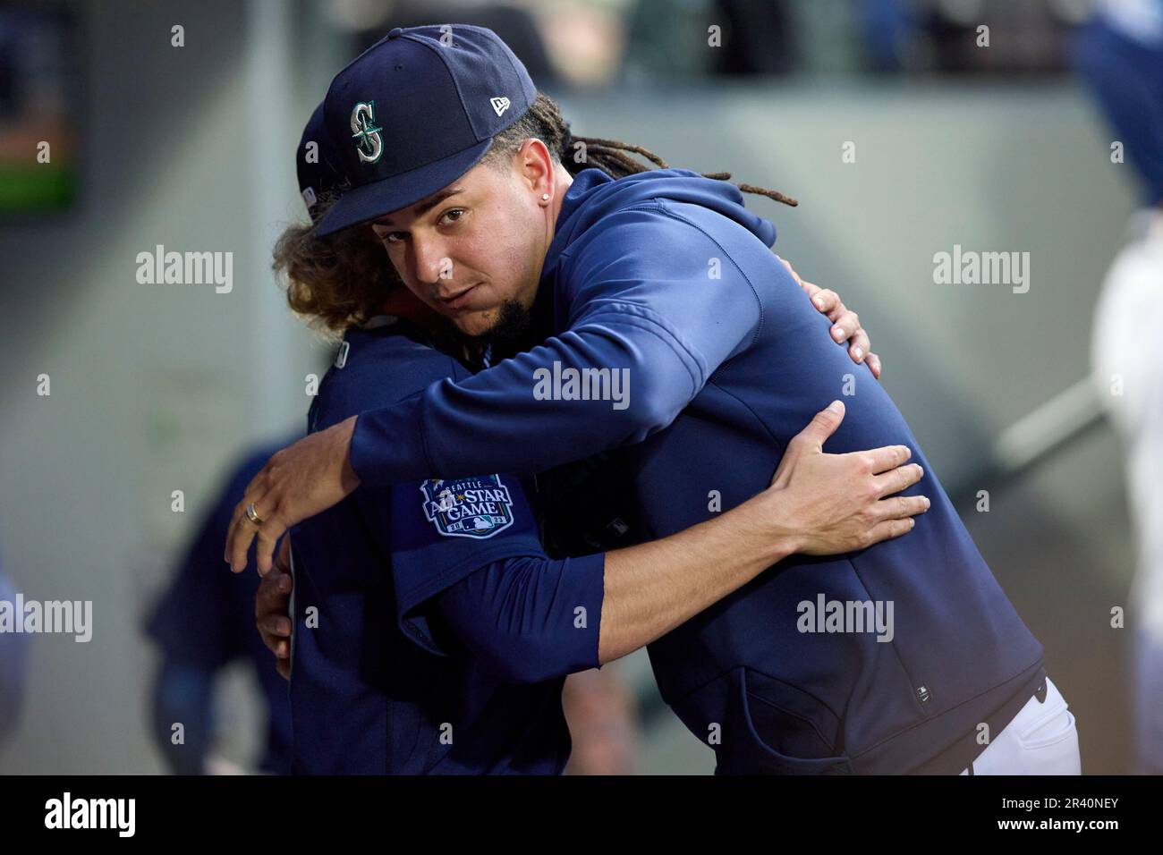 Seattle Mariners starting pitcher Bryce Miller, left, is hugged by Luis ...