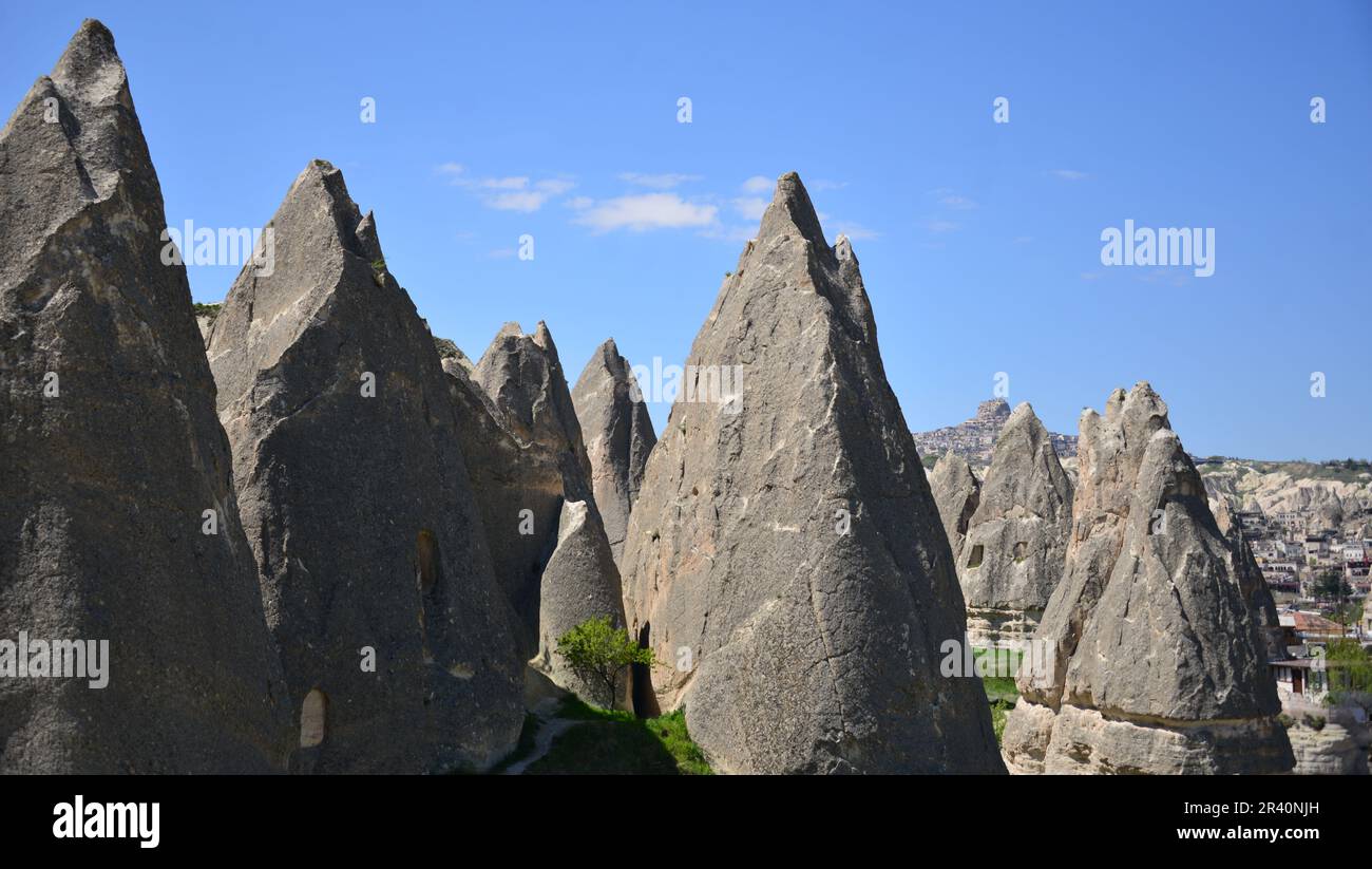Goreme, positioned between the rock formations called fairy chimneys ...