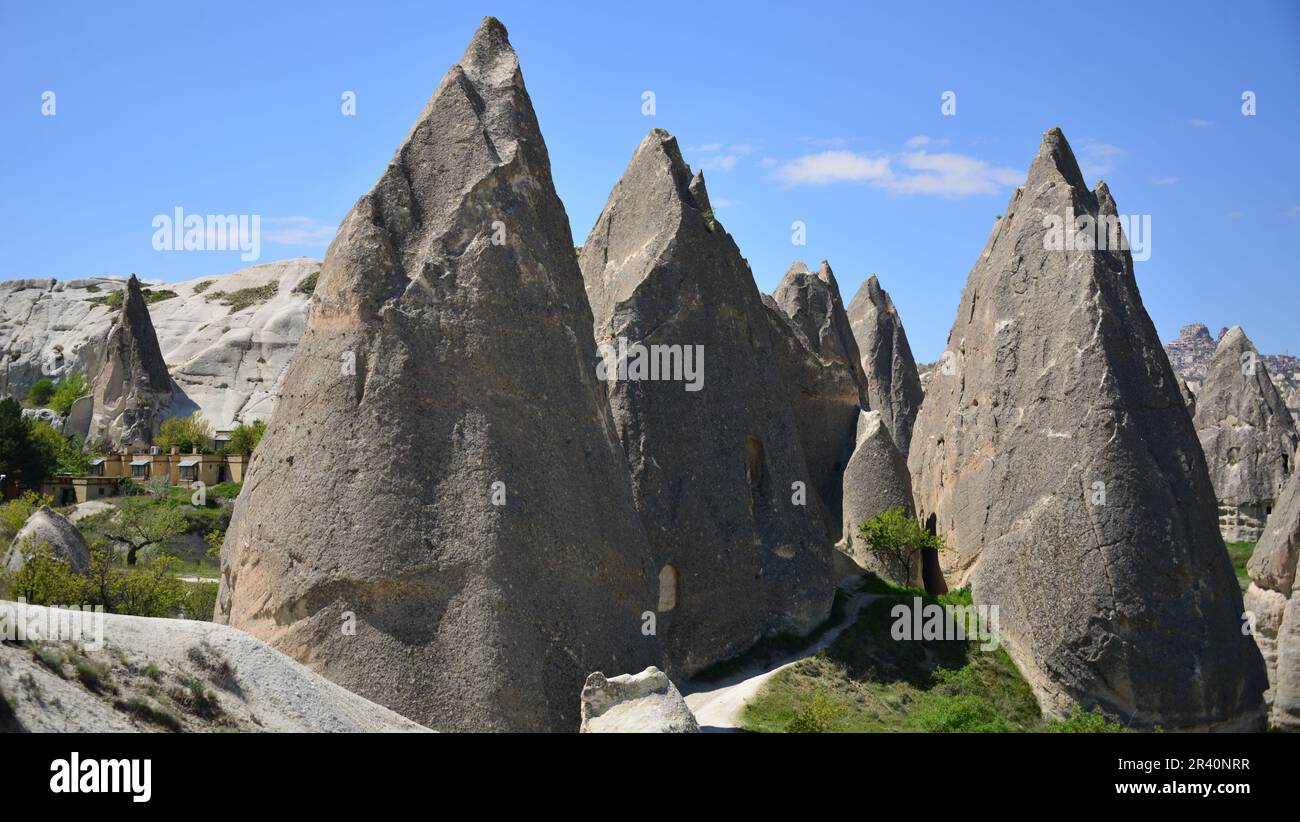 Goreme, positioned between the rock formations called fairy chimneys ...