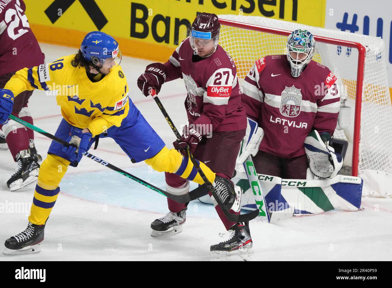 Goalie Arturs Silovs, ruight, Oskars Cibulskis, centre, of Latvia ...