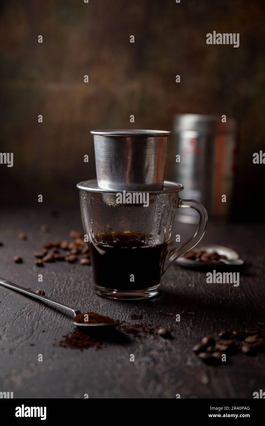Preparation of Vietnamese coffe with aluminum cofe filer on dark ...