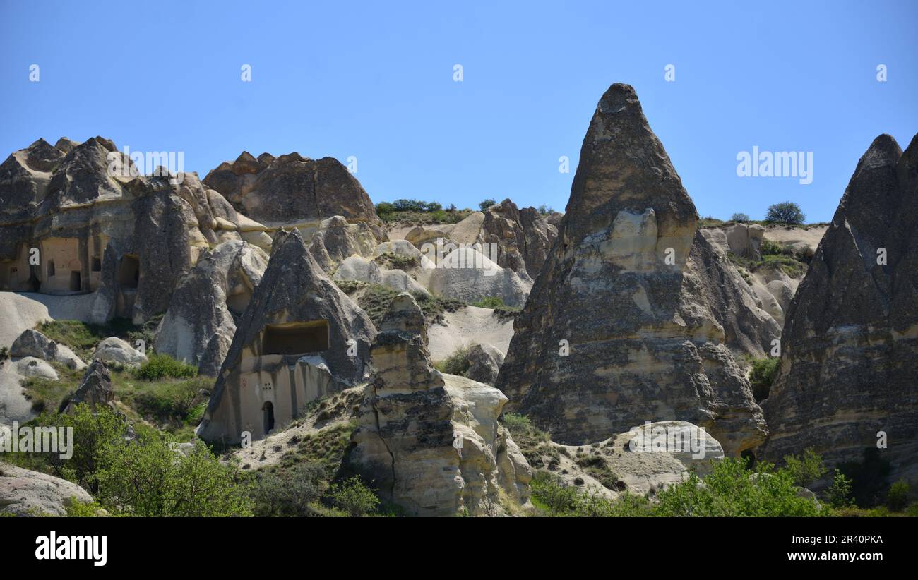 Goreme, positioned between the rock formations called fairy chimneys ...