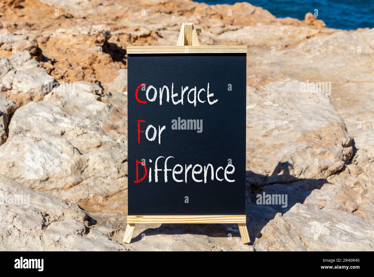 CFD symbol. Concept words CFD contract of difference on beautiful black ...