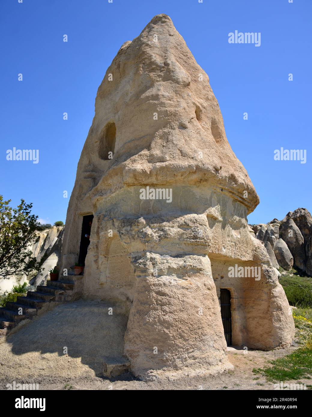 Goreme, positioned between the rock formations called fairy chimneys ...