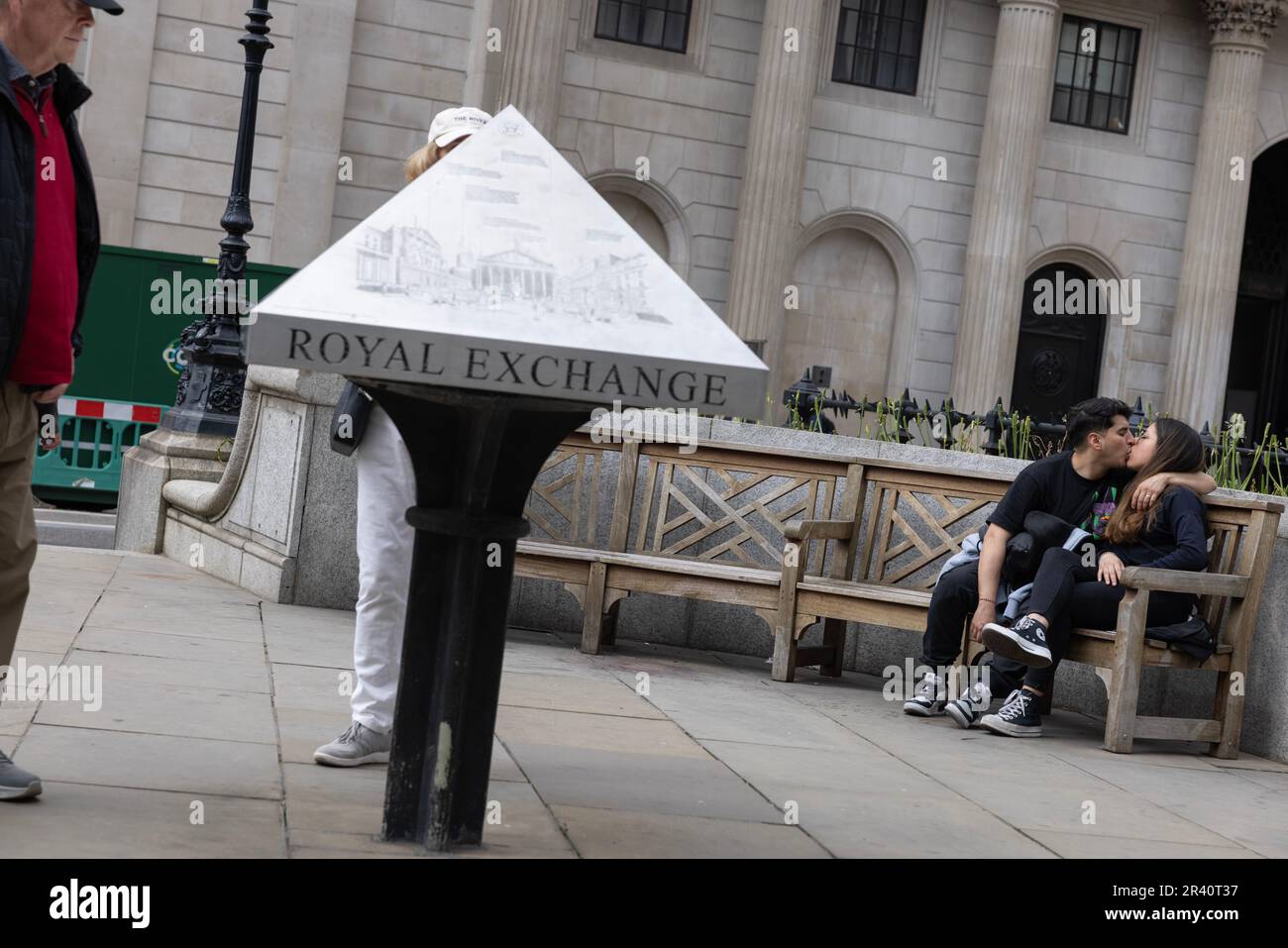 Couple sharing an intimate moment whilst sat outside the Royal Exchange ...