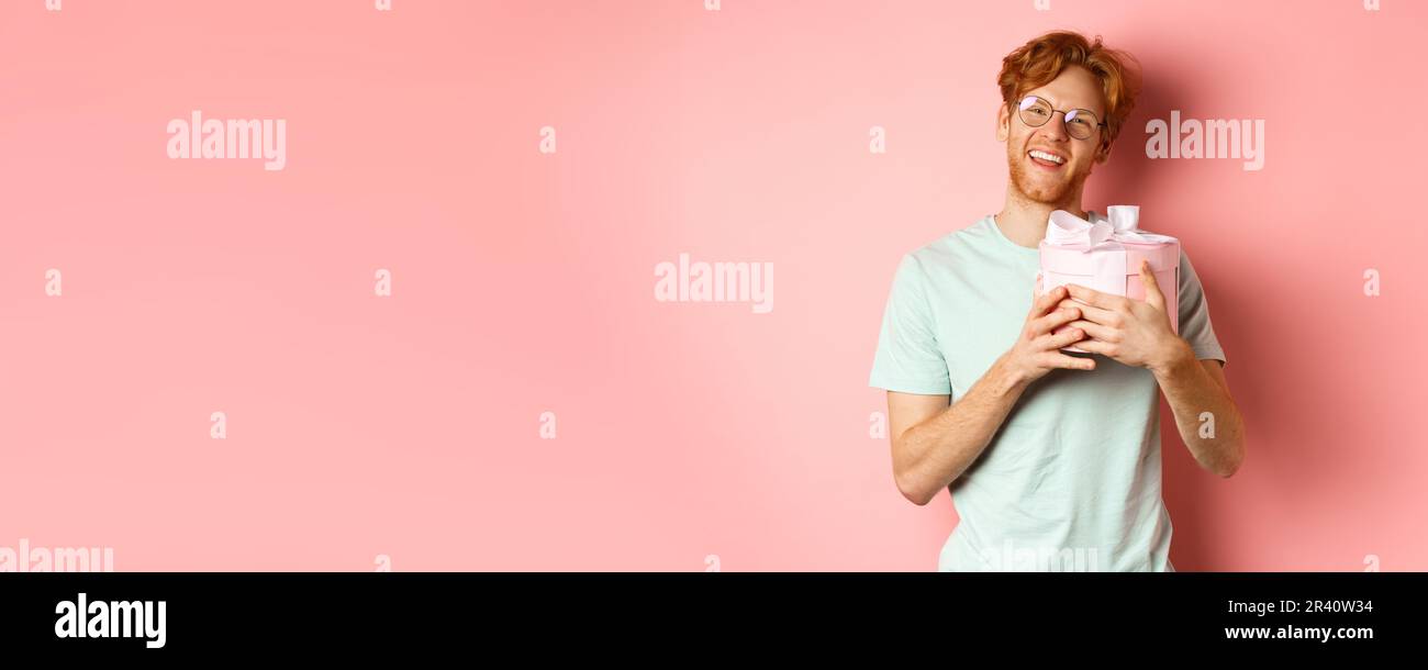 Valentines day and romance concept. Happy redhead boyfriend receive ...