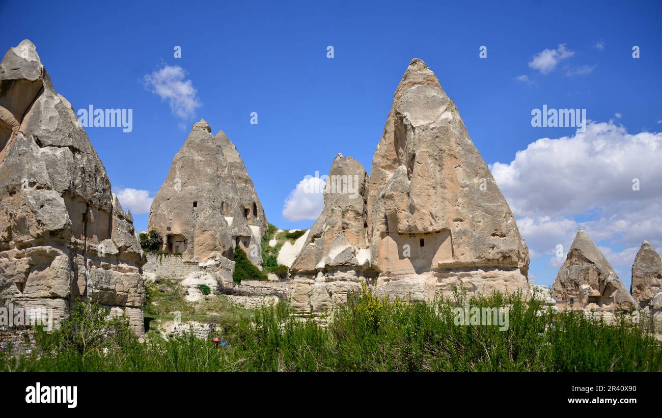 Goreme, positioned between the rock formations called fairy chimneys ...