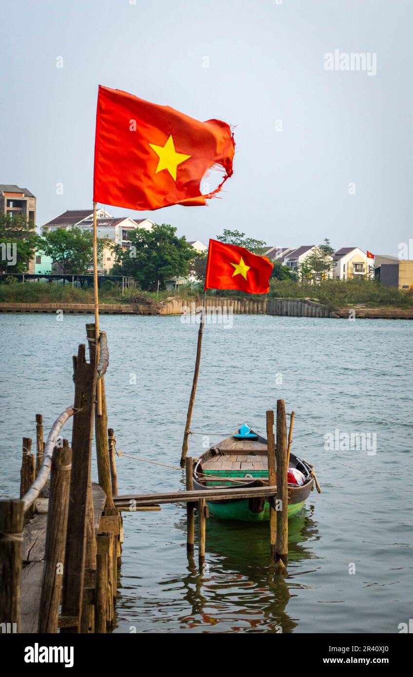 Peaceful river in Vietnam Ho An with a fishing boat and Vietnamese ...