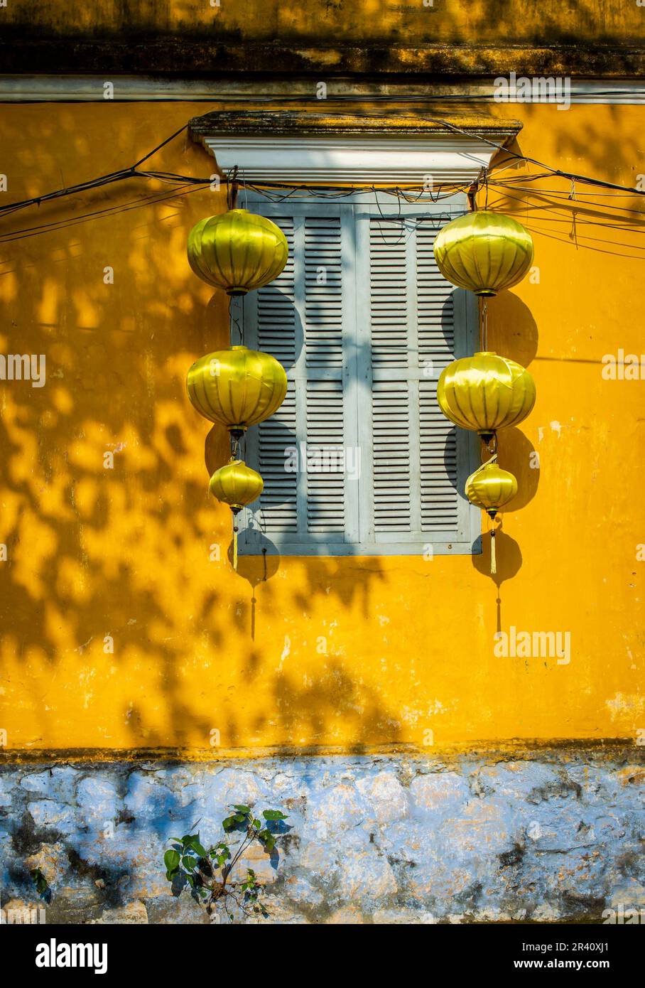 Traditional house in Vietnam Hoi An with yellow wall, light blue window ...