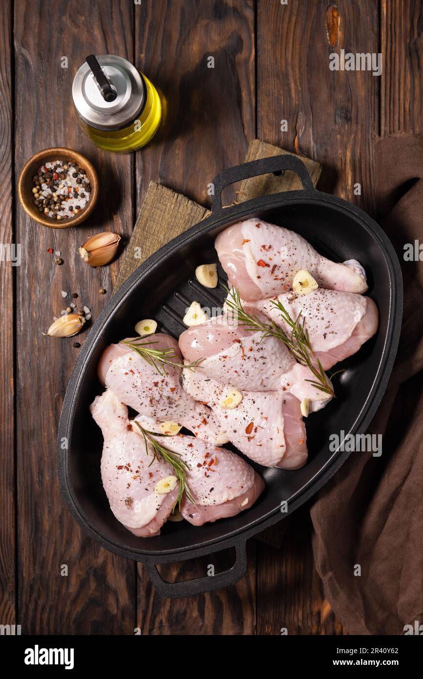 Raw chicken meat. Uncooked chicken legs on wooden cooking table ...