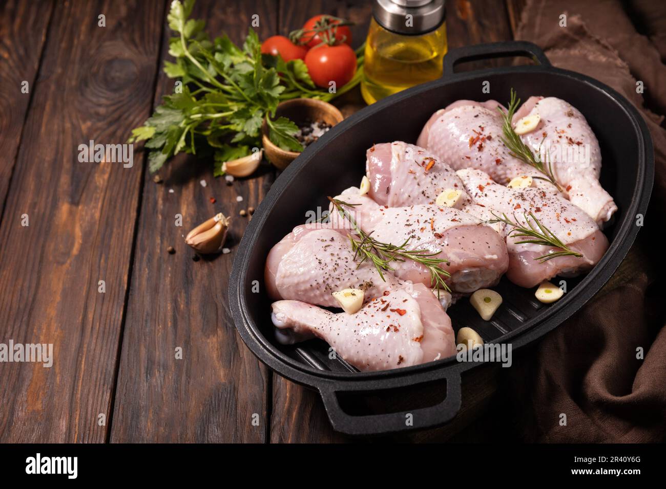Raw chicken meat. Uncooked chicken legs on wooden cooking table ...