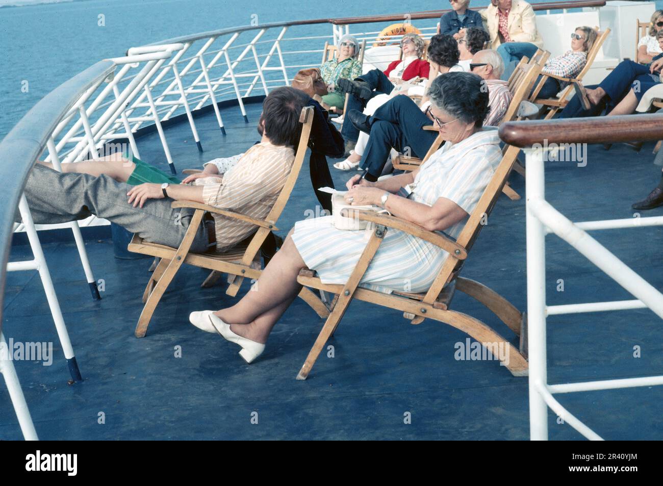 Oslo, Norway- September 1973: Passengers on the sun deck of the ferry ...