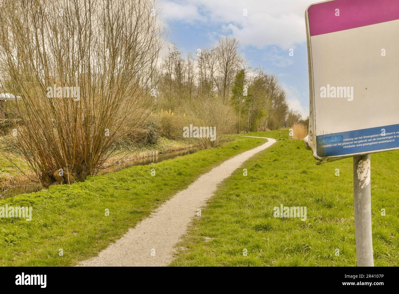 a sign on the side of a path that is not in use, but it's very nice to ...