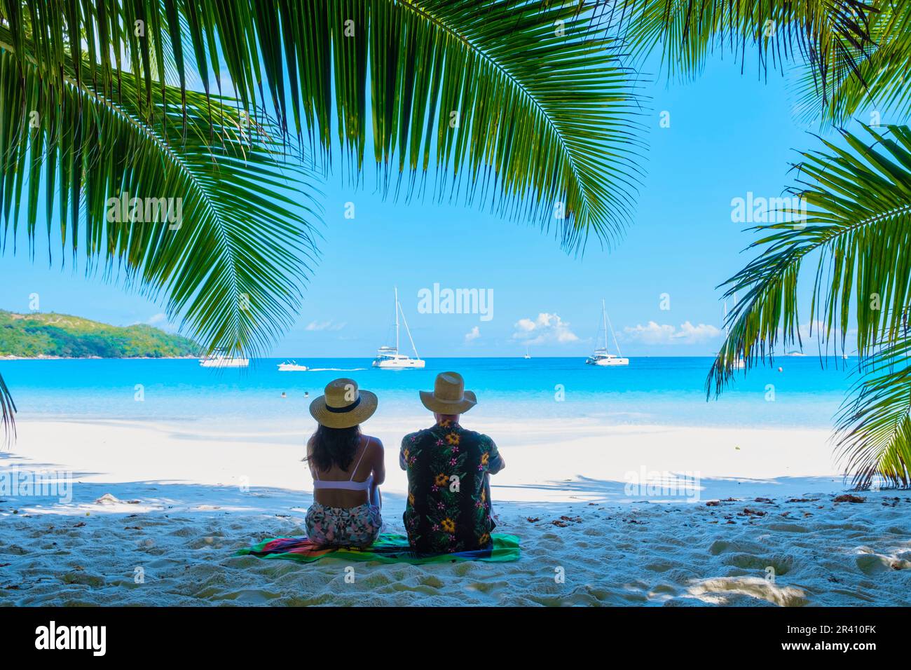 Anse Lazio Praslin Seychelles, young couple men and woman on a tropical ...