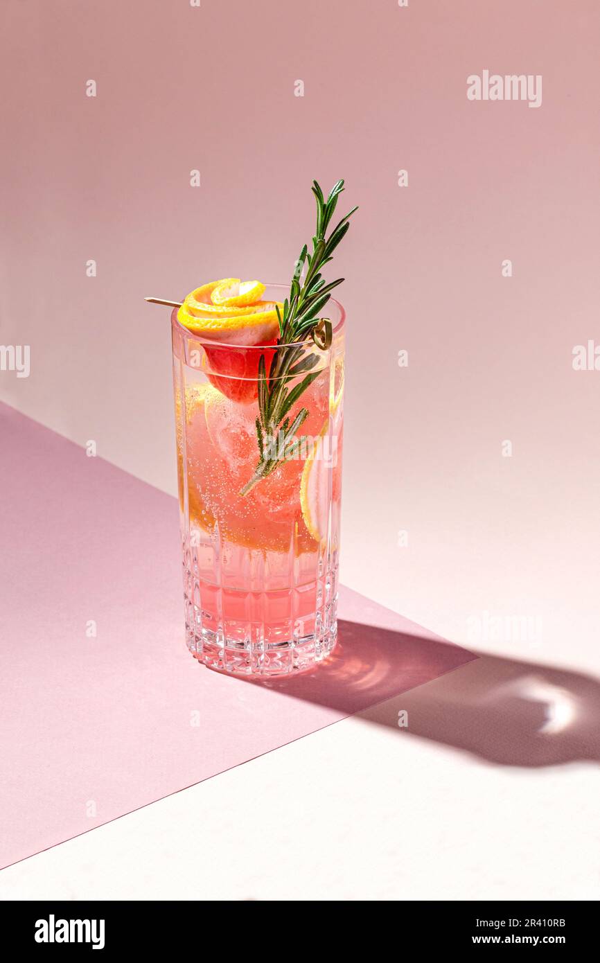 Cold alcoholic or non-alcoholic cocktail on pastel background. Hard ...
