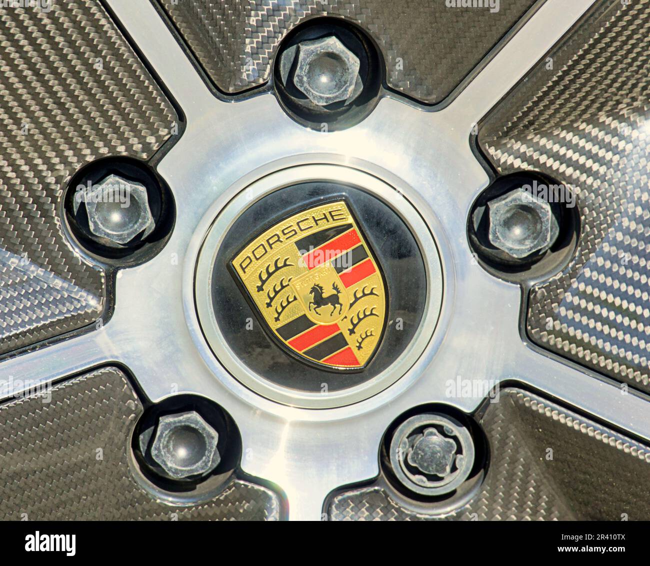porsche wheel with nuts and logo Stock Photo - Alamy