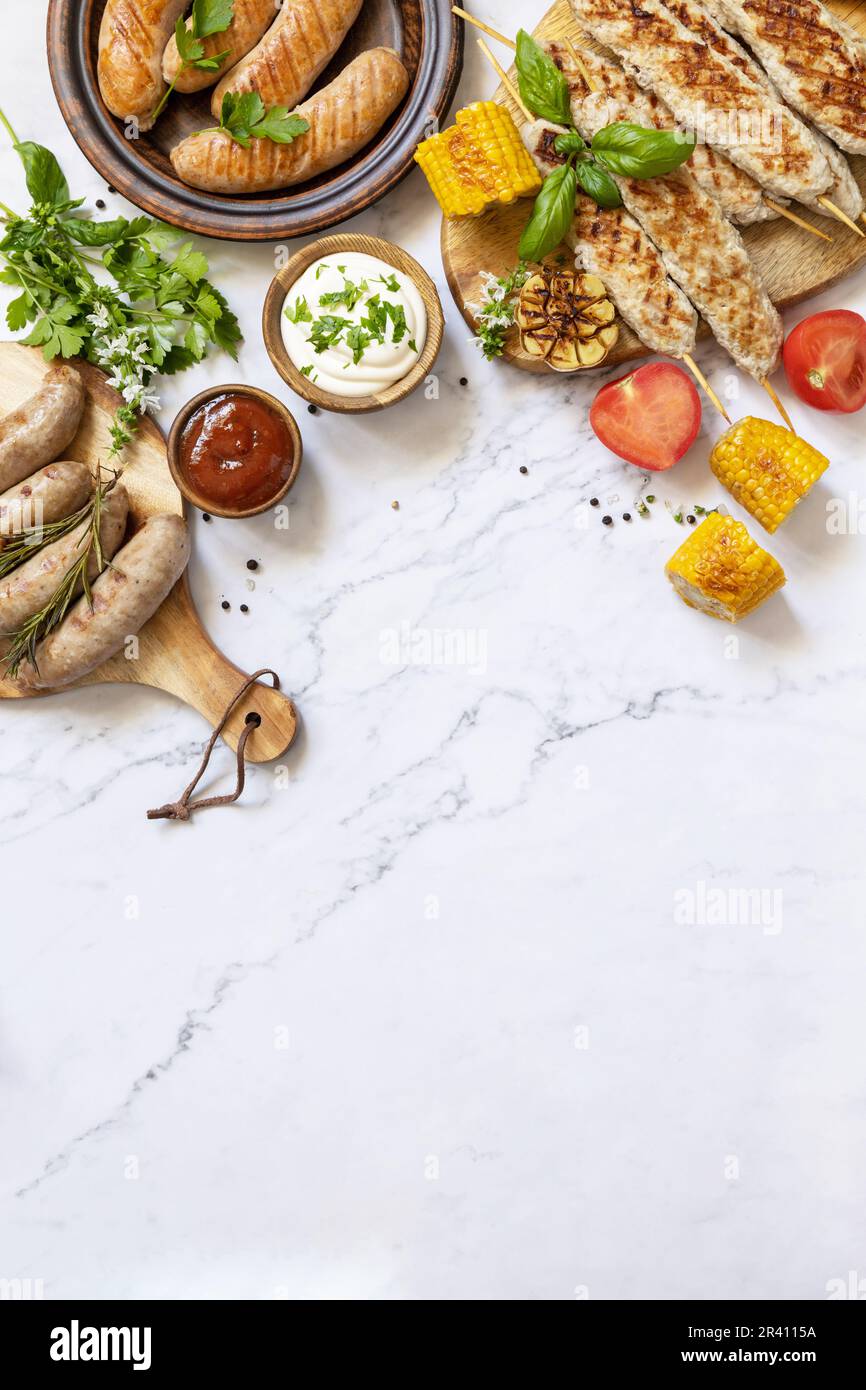 Summer party food. Grill food menu. Various bbq grilled sausages with ...