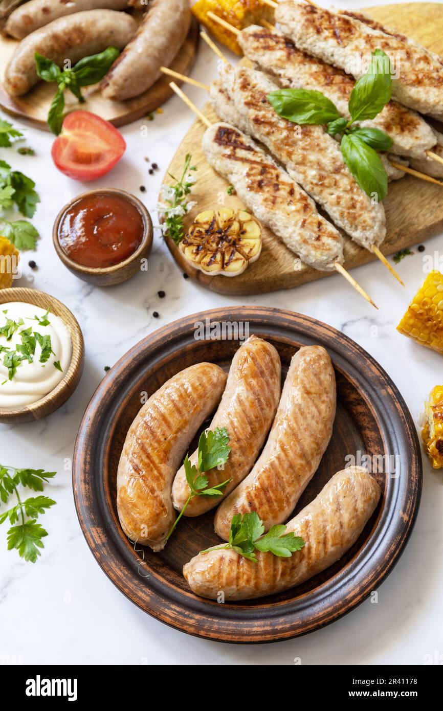Summer party food. Grill food menu. Various bbq grilled sausages with ...