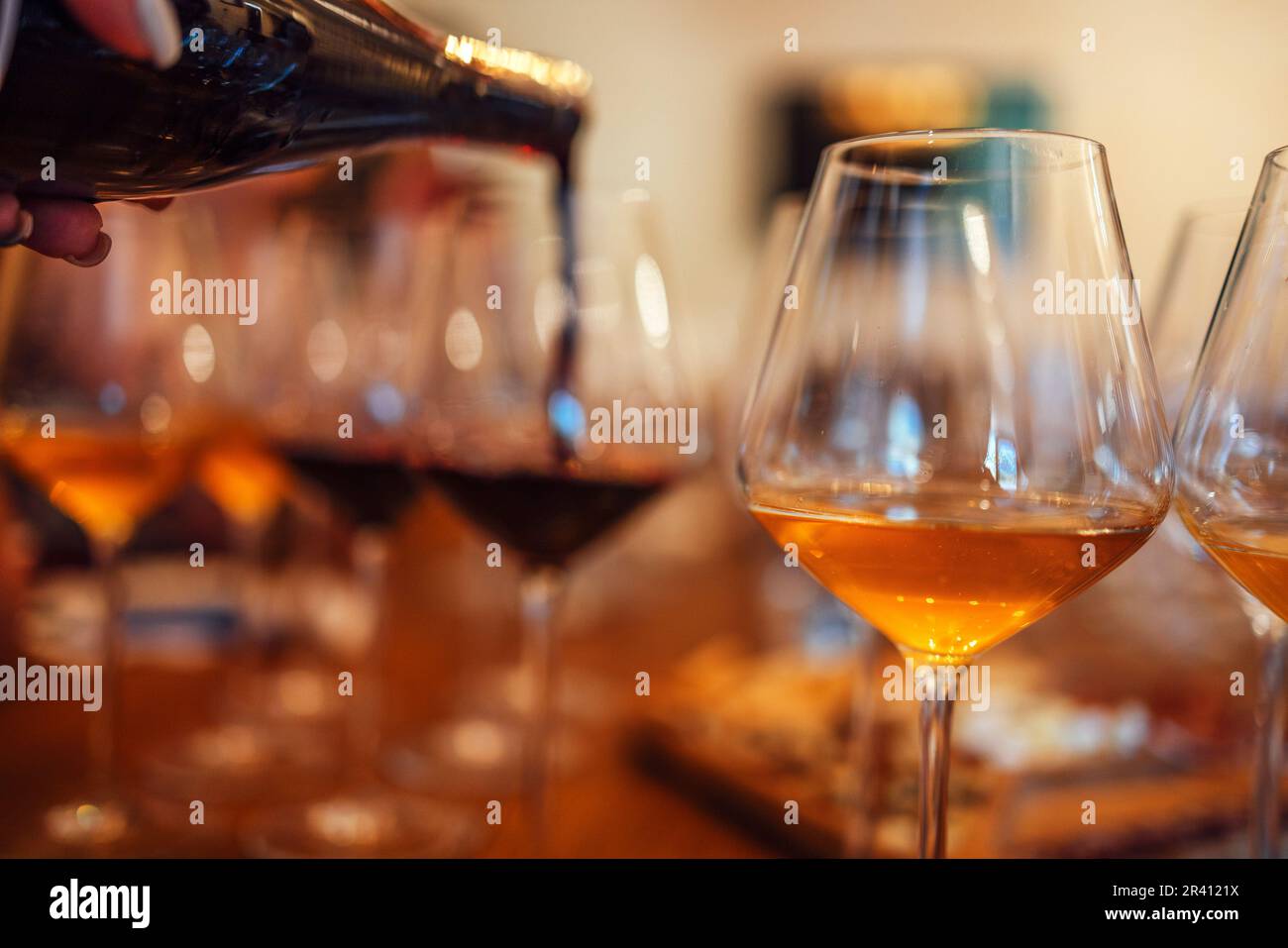 Glass goblets placed in rows on table during wine tasting procedure in ...