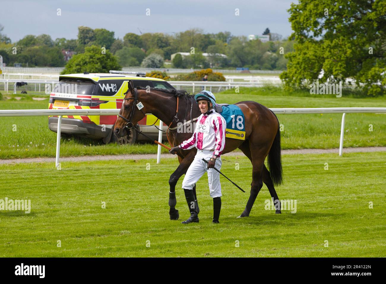 Jockey Duran Fentiman walking towards the starting gates with racehorse ...