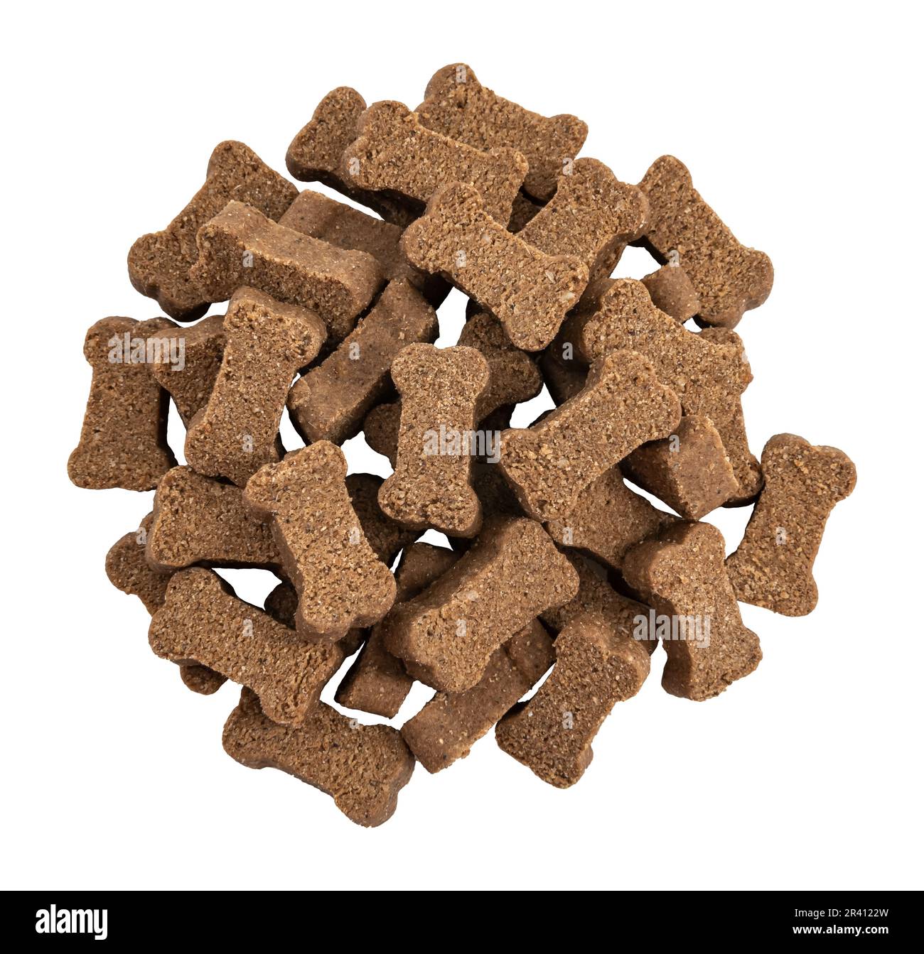 A slide of dry dog food on a white background. Food for dogs and cats ...