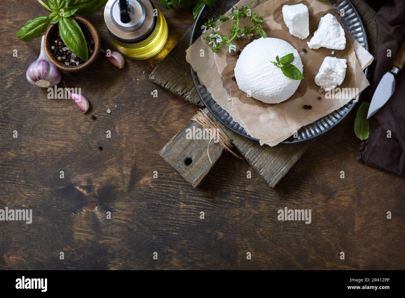 Homemade Italian ricotta cheese or cottage cheese with basil on a ...