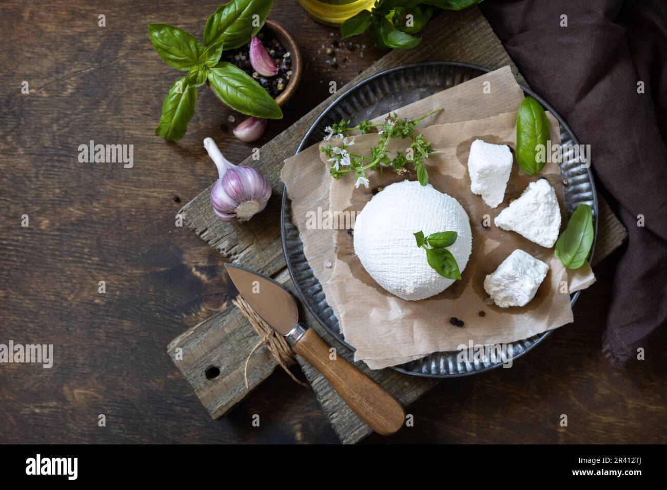 Homemade Italian ricotta cheese or cottage cheese with basil on a ...