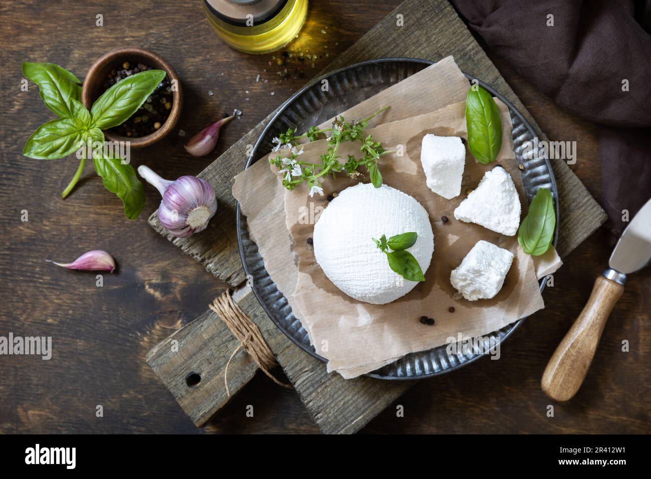 Homemade Italian ricotta cheese or cottage cheese with basil on a ...