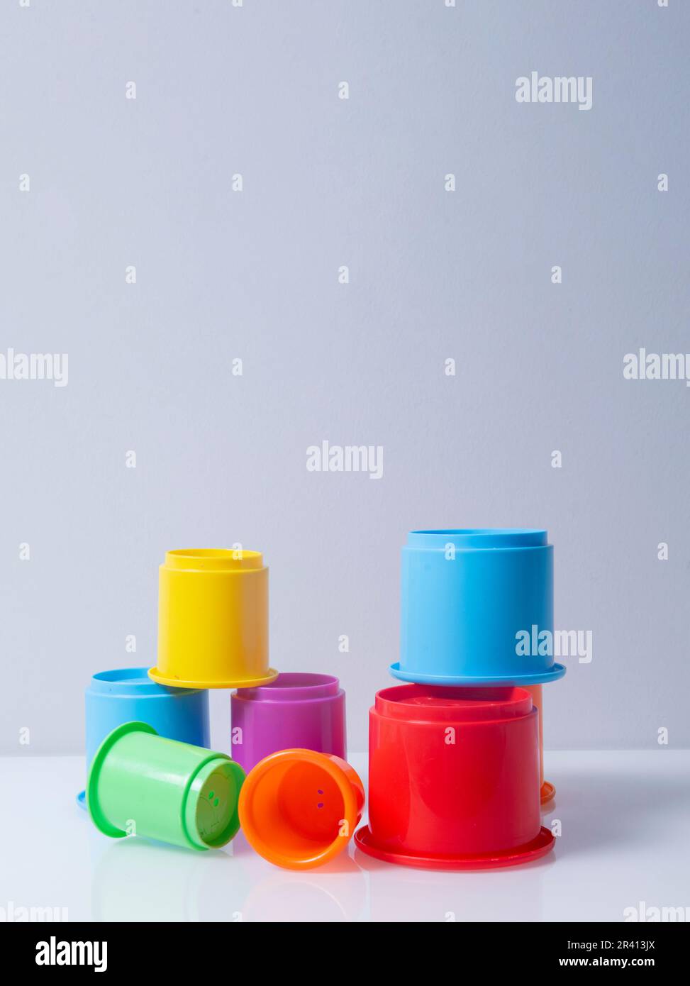 Colorful stacking plastic cups on white background.balance concept Stock Photo - Alamy