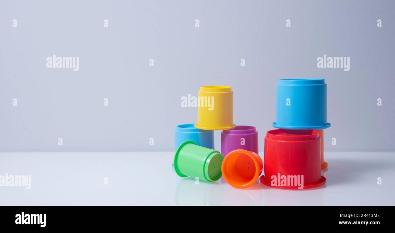 Colorful stacking plastic cups on white background.balance concept Stock Photo - Alamy