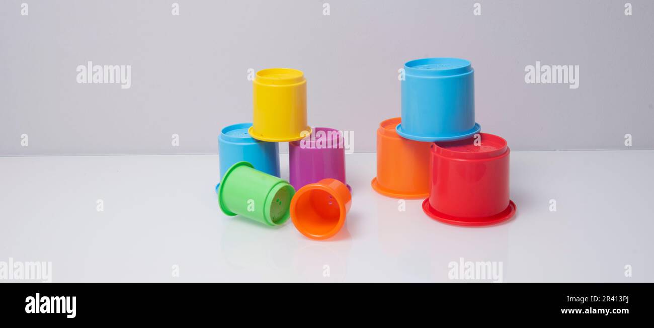 Colorful stacking plastic cups on white background.balance concept Stock Photo - Alamy