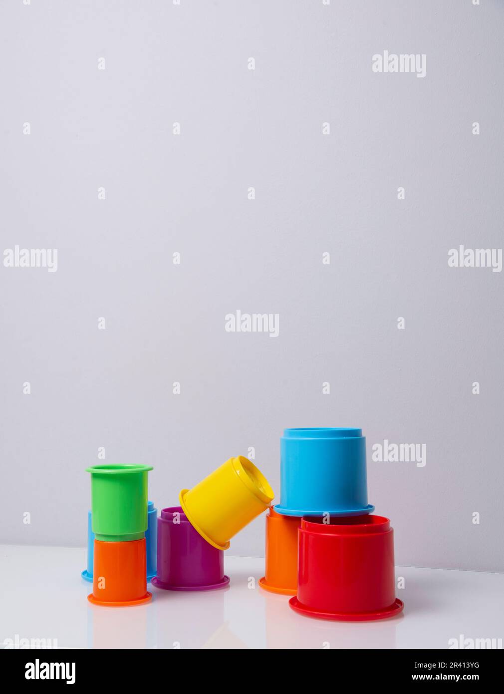 Colorful stacking plastic cups on white background.balance concept Stock Photo - Alamy