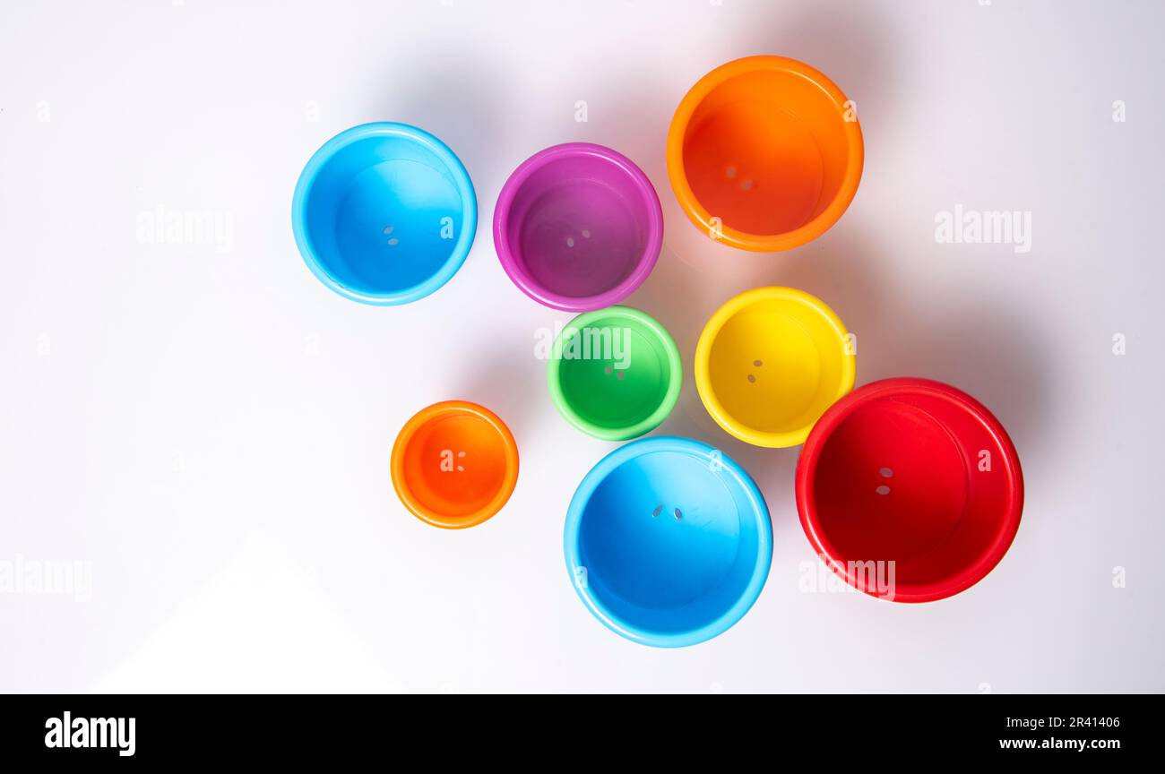 Colorful stacking plastic cups on white background.balance concept Stock Photo - Alamy