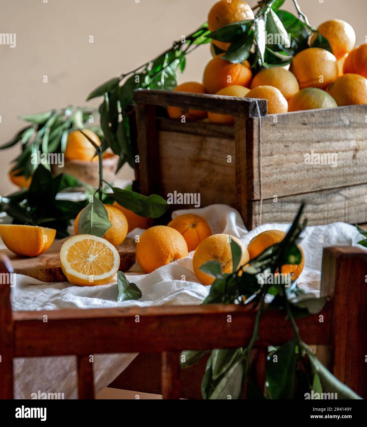 Table with box of fresh orange with orange tree branch and fresh orange ...