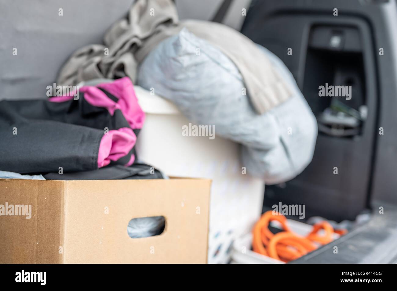 Cloths and material bagged and boxed for donation in the back of a ...