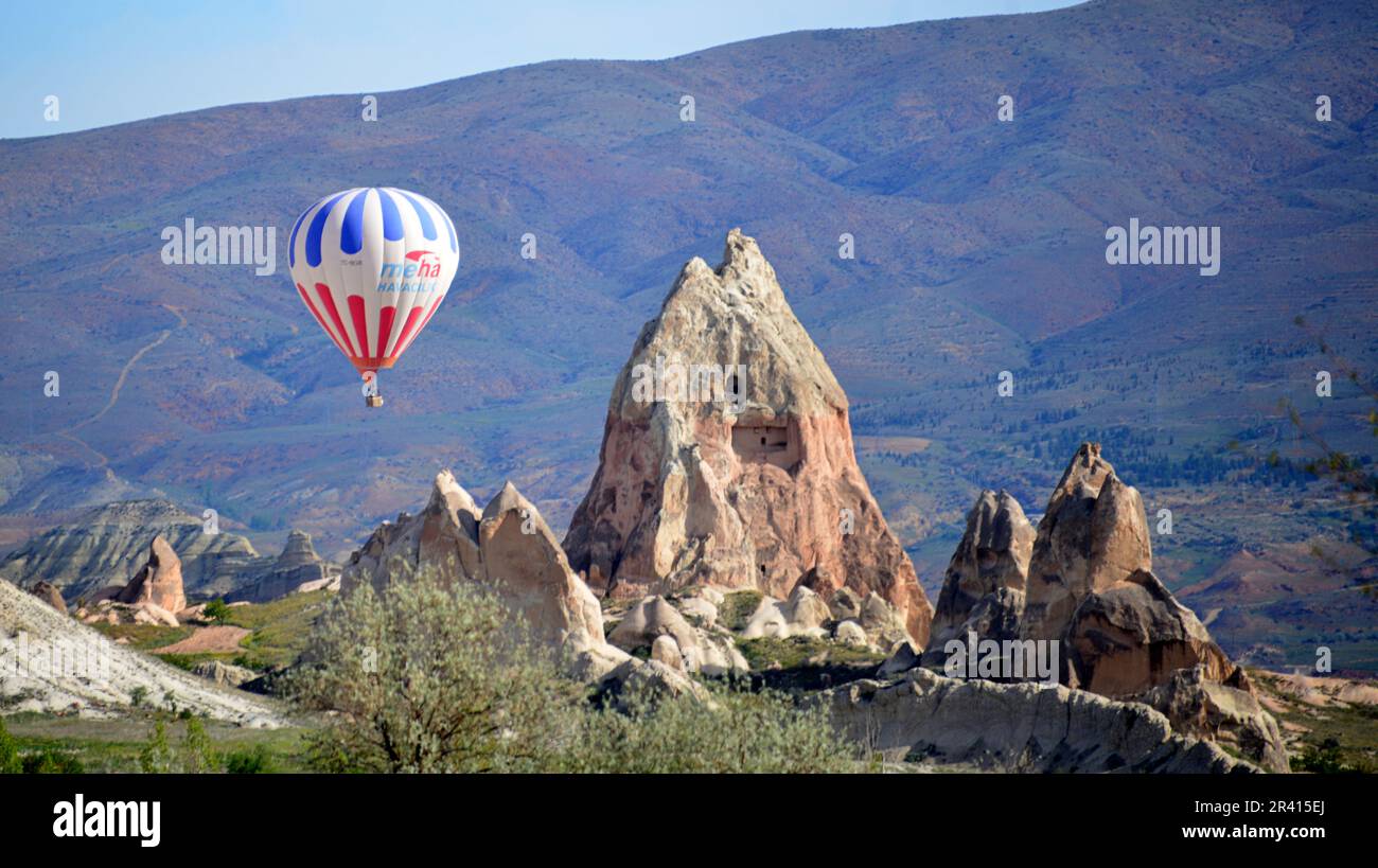 Goreme, positioned between the rock formations called fairy chimneys ...
