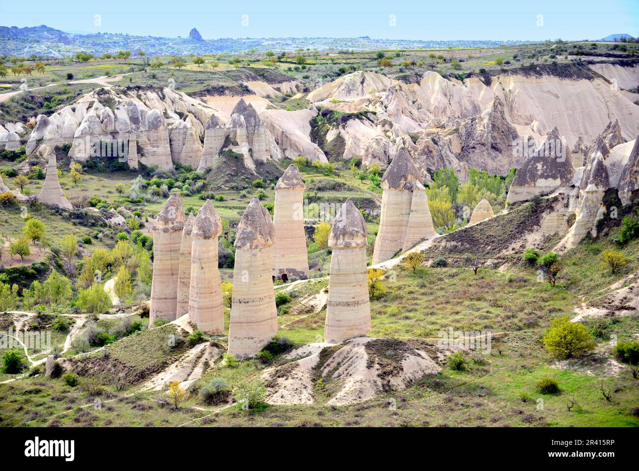Goreme, positioned between the rock formations called fairy chimneys ...