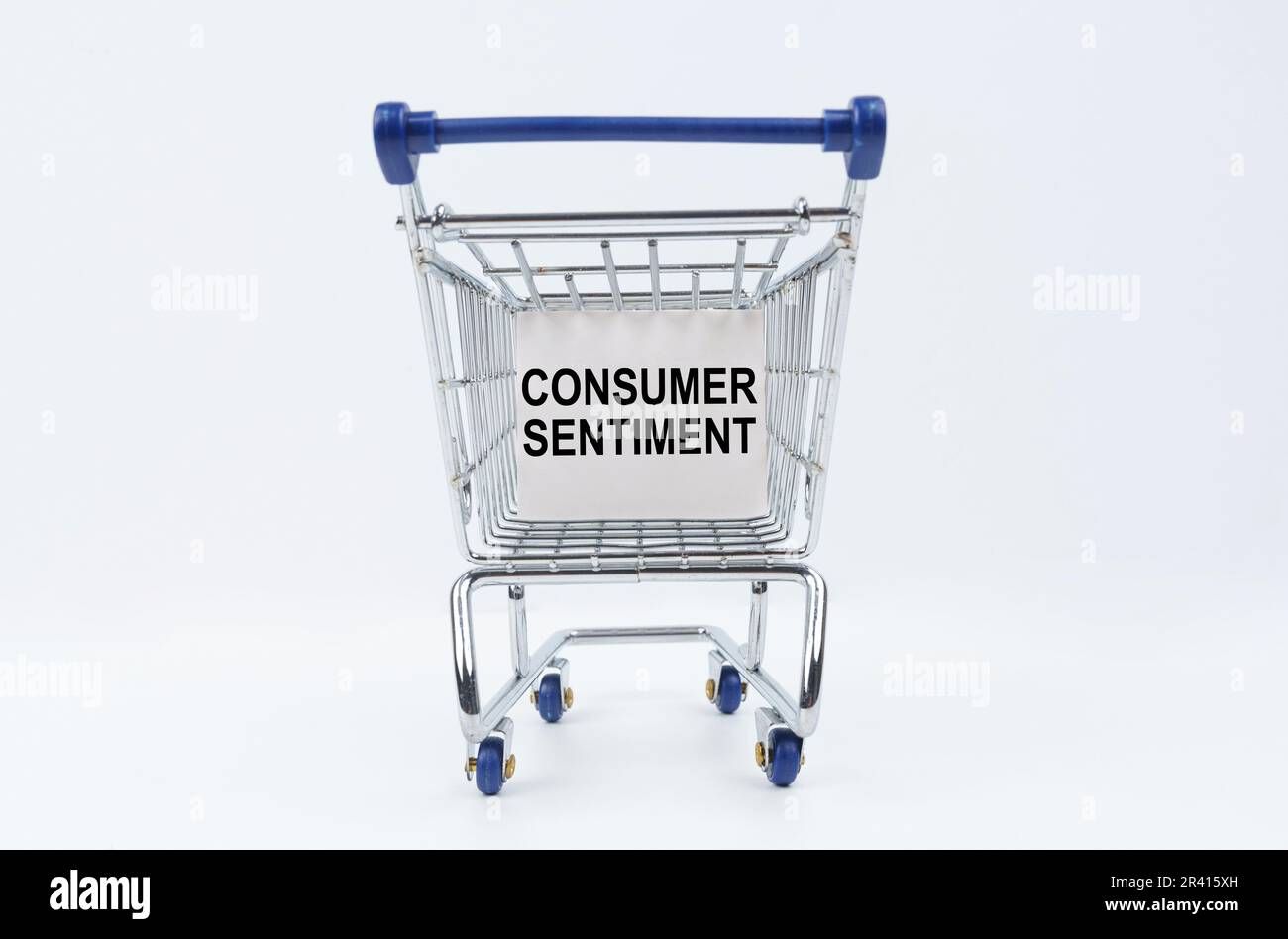 Business concept. On a white background is a shopping cart with a sign ...