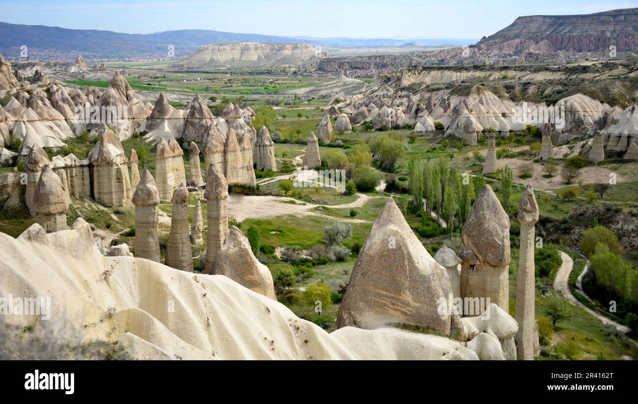 Goreme, positioned between the rock formations called fairy chimneys ...