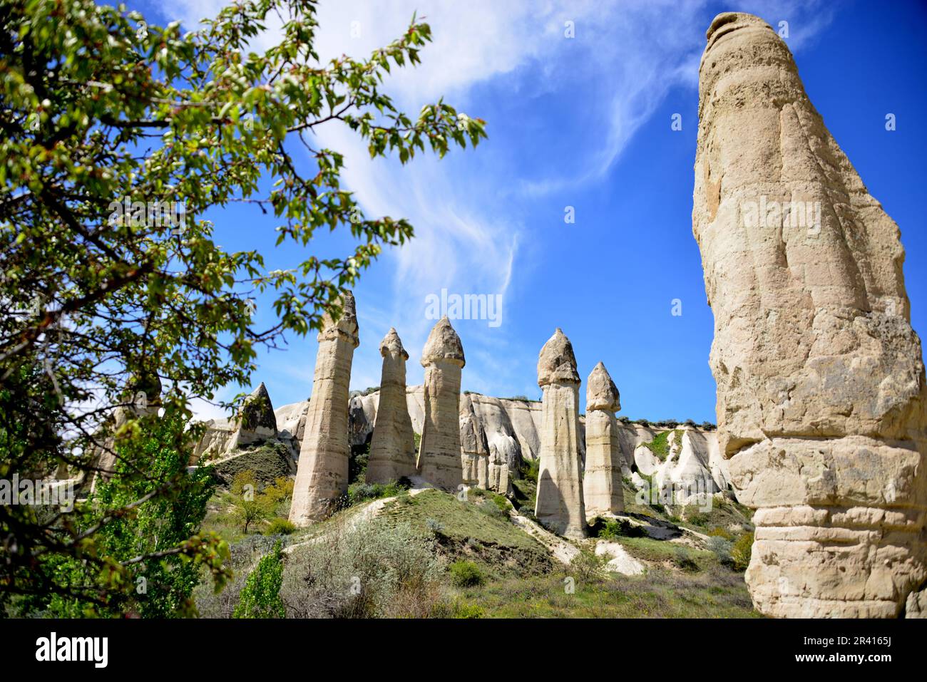 Goreme, positioned between the rock formations called fairy chimneys ...