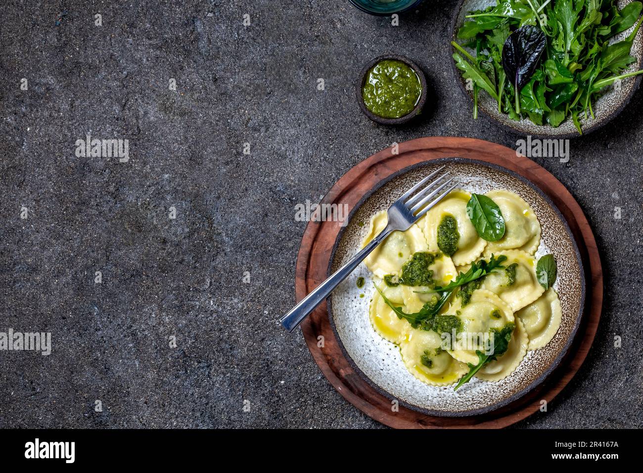 Italian spinach ricotta ravioli, Top view, black background, copy space ...