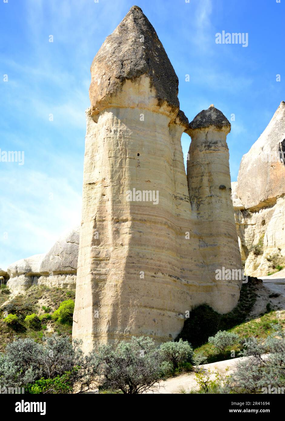 Goreme, positioned between the rock formations called fairy chimneys ...