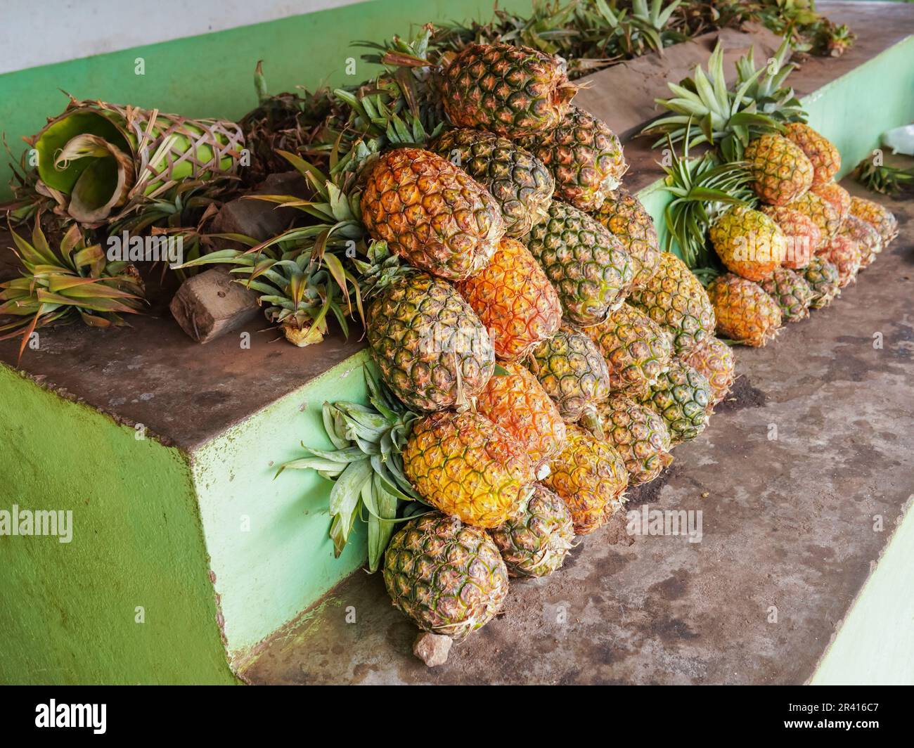 Pile of fresh pineapples on display at street market in Madagascar ...