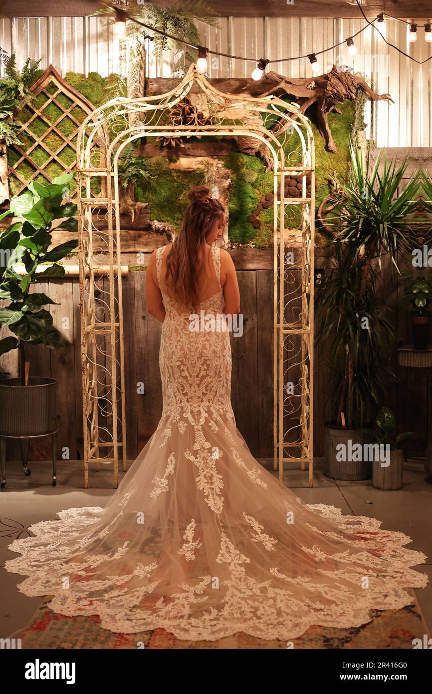 Bride in A White Dress Looks Over Her Shoulder at the Alter During ...