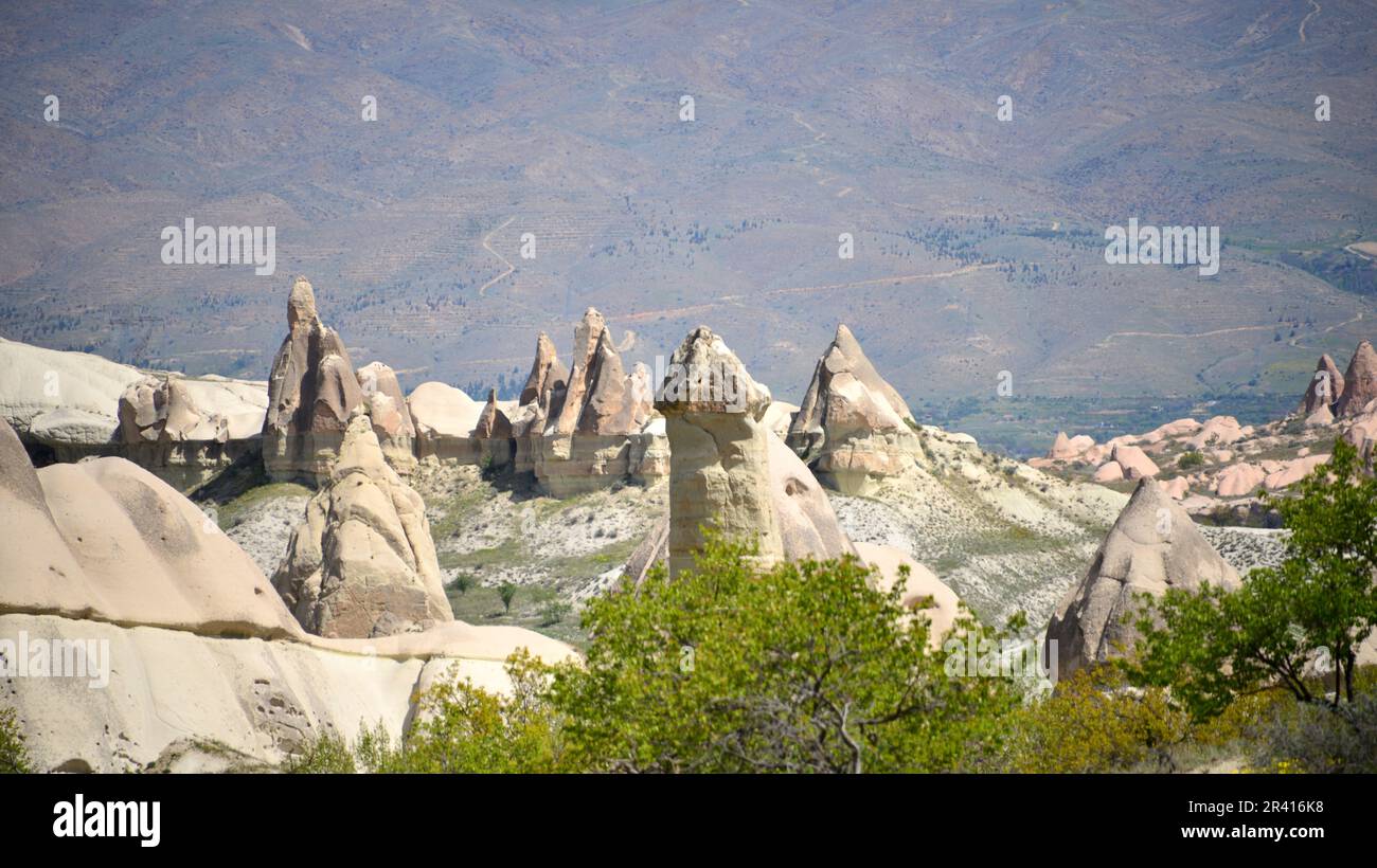 Goreme, positioned between the rock formations called fairy chimneys ...