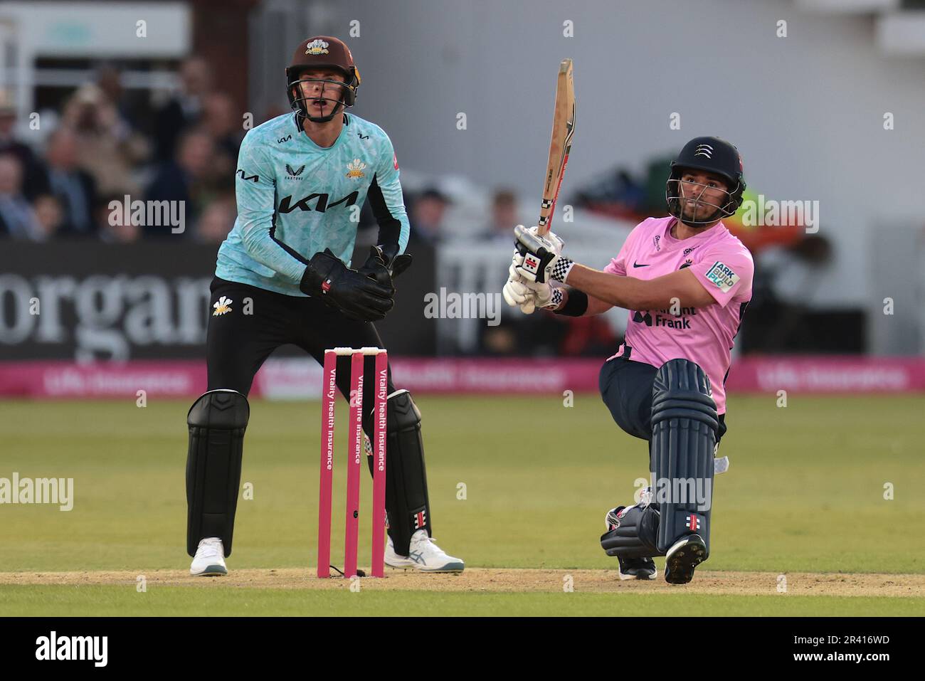 25 May, 2023. London, UK. Middlesex’s Max Holden hits a six as ...